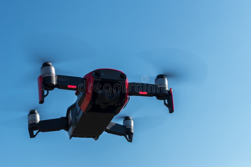 Small Sized Red Drone with High Resolution Camera Hovering in Air for ...