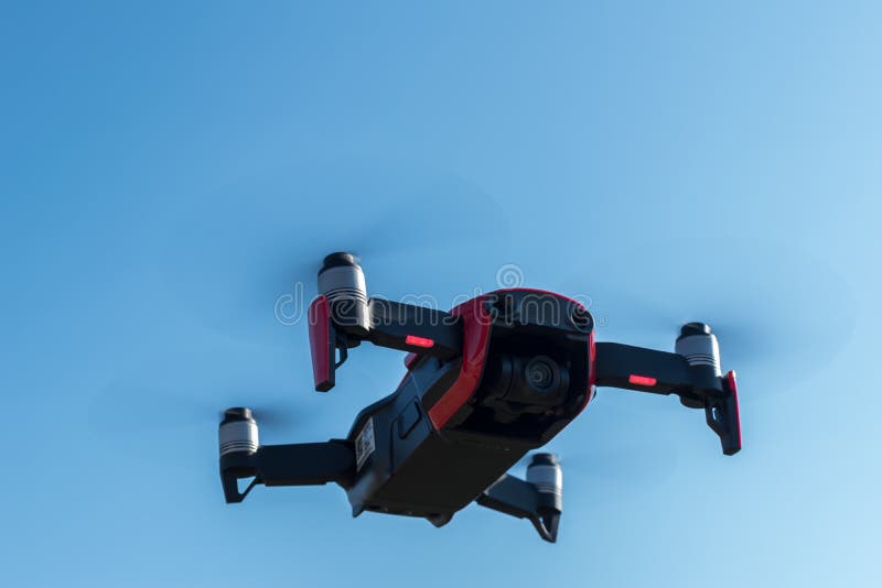 Small Sized Red Drone with High Resolution Camera Hovering in Air for ...