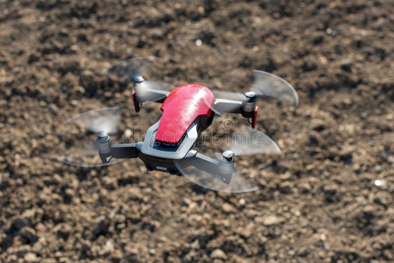 Small Sized Red Drone with High Resolution Camera Hovering in Air for ...