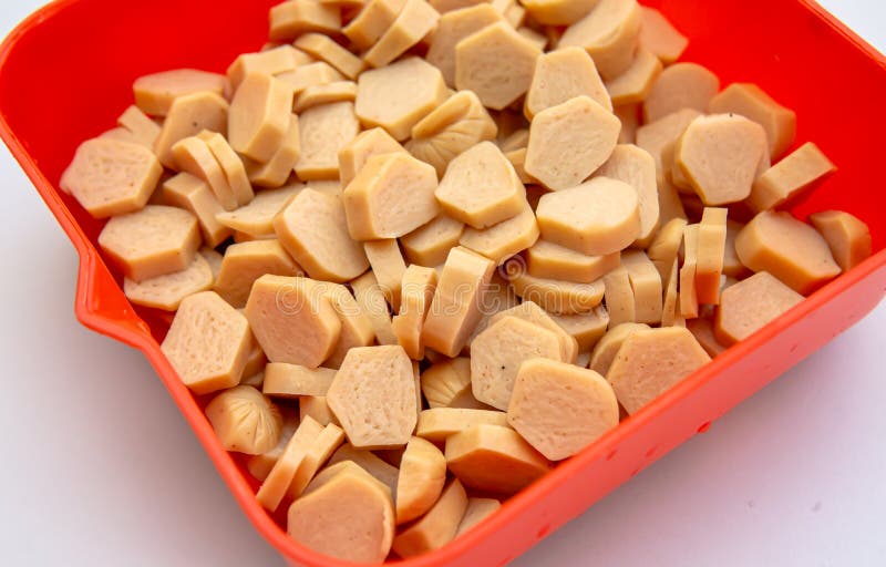 Small Slices of Raw Chicken Sausage in a Red Container Stock Photo ...