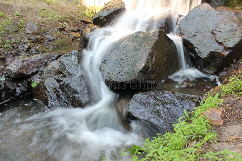 A Small Soft Waterfall Going Down the Rocks Stock Photo - Image of soft ...