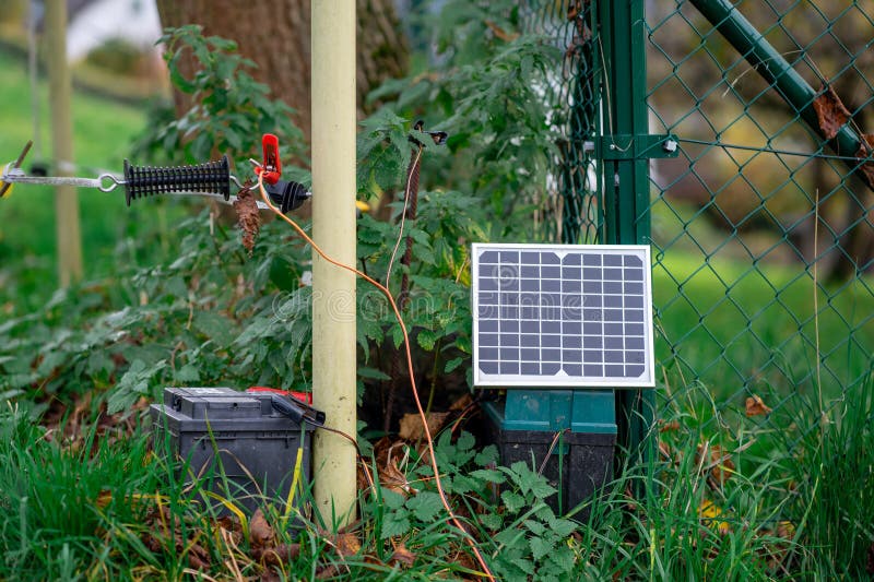 Small Solar Farm, View of a Small Solar Panel Connected To a Fence on a ...