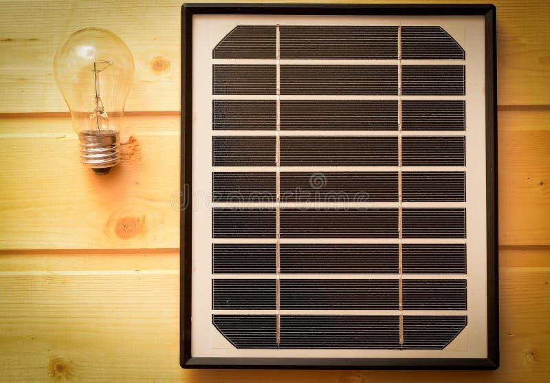 Small Solar Panel and a Light Bulb Stock Image - Image of panel, cell ...