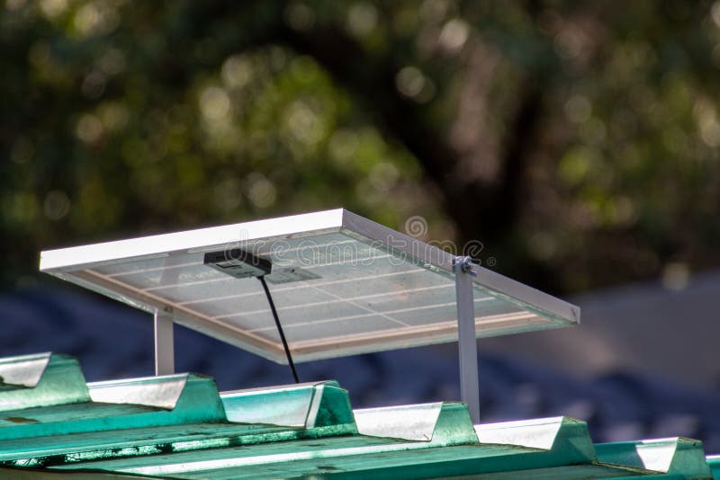 A Small Solar Panel on the Roof of a Verandah Stock Image - Image of ...