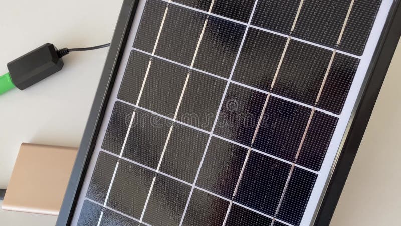 Small Solar Panel in the Room with a Plugged-in Power Bank. Smart ...