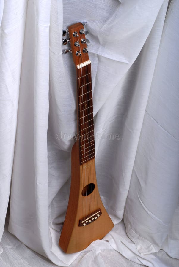 Small specialty guitar editorial photo. Image of guitar - 87605031