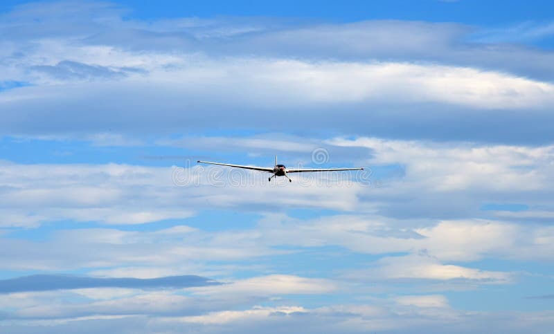 A Small Single Engine Aircraft Flying in the Blue Sky Stock Image ...