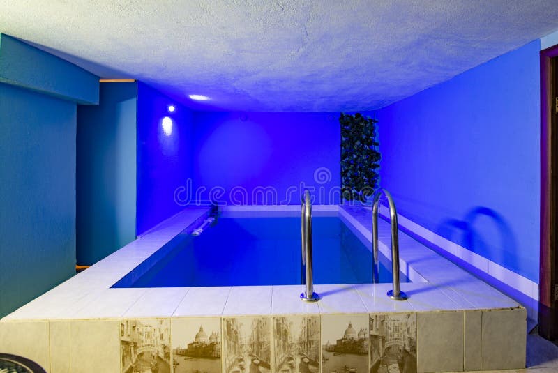 Square Pool for Evaporation of Salt and a Pond with Pink Water. Stock ...