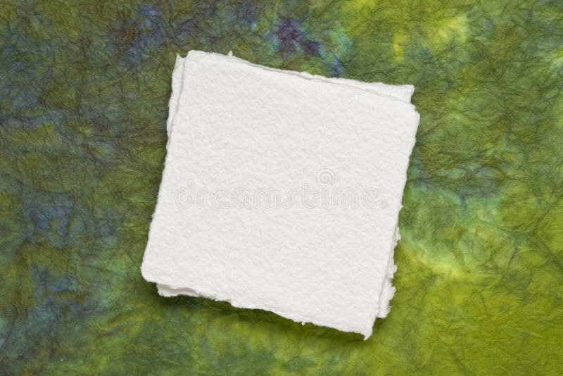 Small Square Sheet of Blank White Paper Against Marbled Paper Stock ...