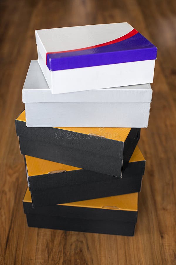 A Small Stack of Cardboard Boxes on the Floor. Stock Photo - Image of ...