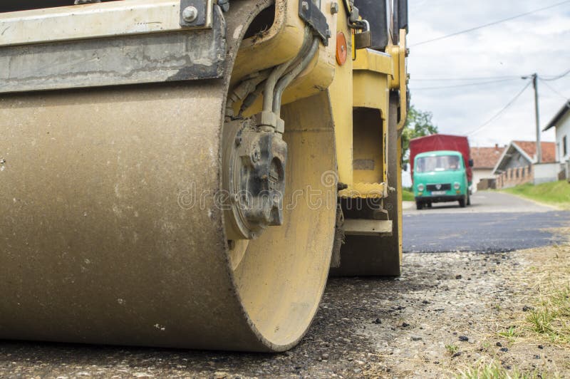Small steamroller on road stock photo. Image of bitumen - 55814316