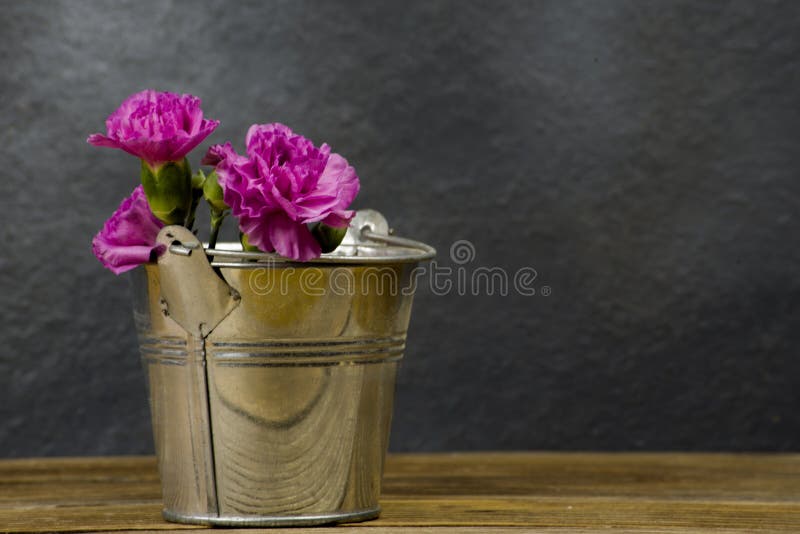 Small Steel Cauldron with Flowers on Wood Stock Photo - Image of ...