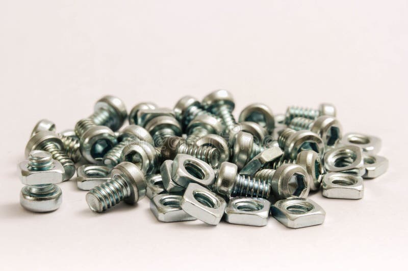 Small steel nuts and bolts stock image. Image of bolts - 28865401