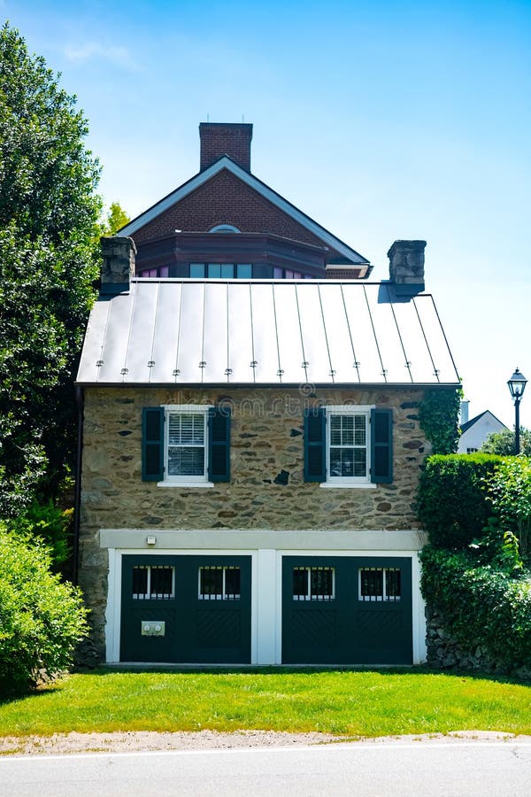 Small Stone House in American Colonial Style. Fireplace Chimneys ...
