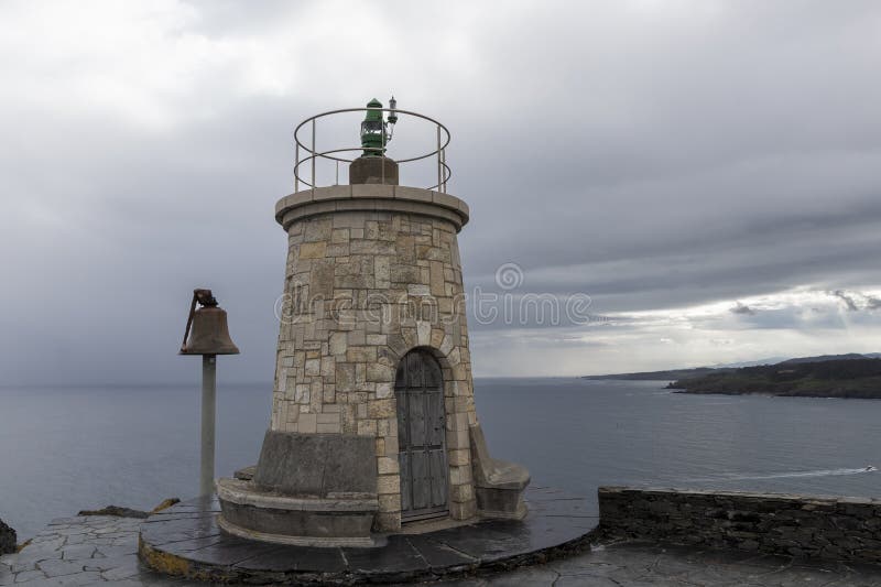 Small Stone Lighthouse Guiding Ships on Cloudy Day at Sea Stock Image ...