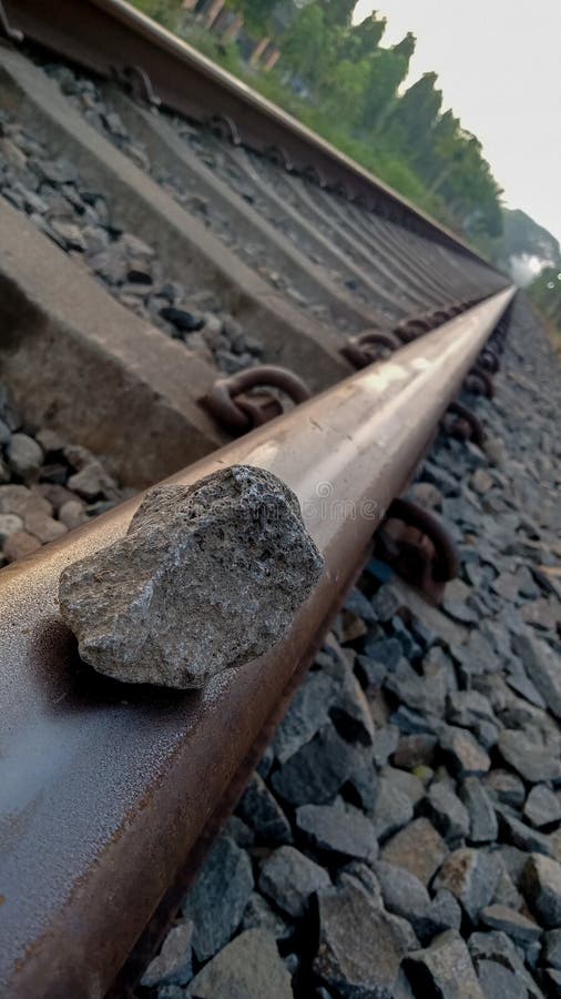 A Small Stone, is on a Railroad Track Made of Steel. Stock Photo ...