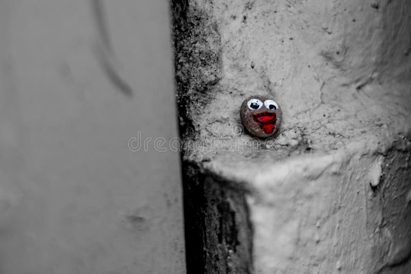 Small Stone with a Smiley Face on a Grey Wall Stock Photo - Image of ...