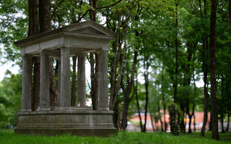 Small Stone Structure Resembling a Classical Greek Temple with Fluted ...
