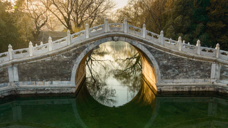 A Small Stone White Bridge on the Artificial Kunming Lake, Mirror Image ...