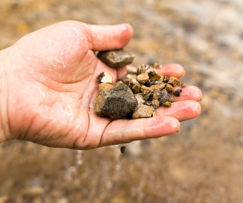 Small Stones in the Hand on the Pond Stock Photo - Image of outdoor ...