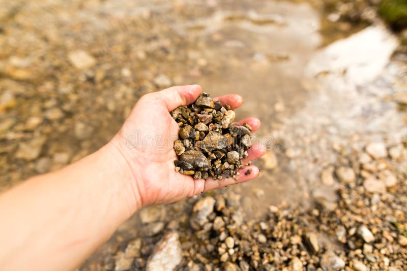 Small Stones in the Hand on the Pond Stock Photo - Image of summer ...