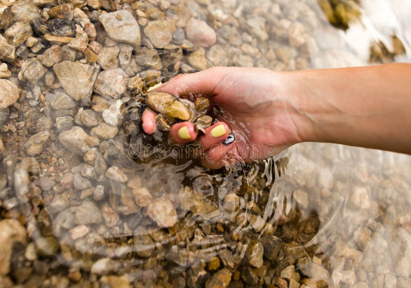 Small Stones in the Hand on the Pond Stock Photo - Image of natural ...