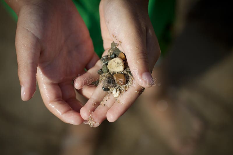 Small stones in hands stock photo. Image of fingers, children - 45597218