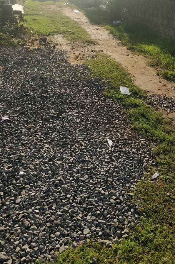 Small Stones Scattered beside a Thin Roadway Stock Photo - Image of ...