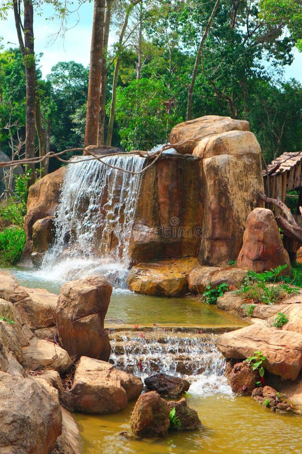 A Small Stony Beautiful Waterfall in a Tropical Forest Stock Photo ...
