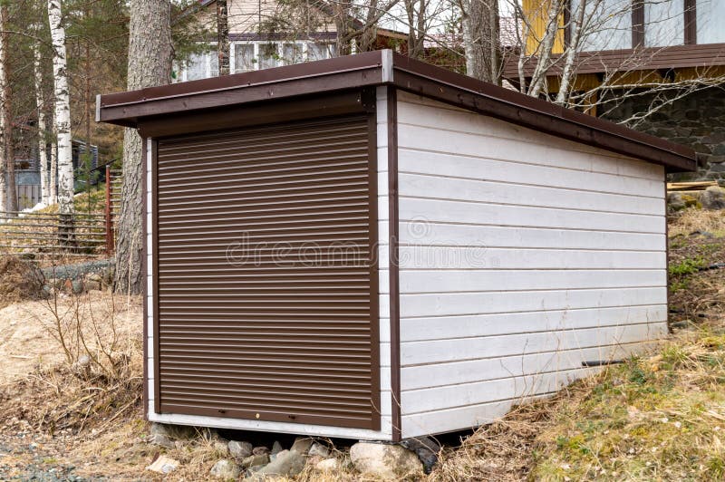 Small Storage Building with Shutter instead of Door Stock Photo - Image ...