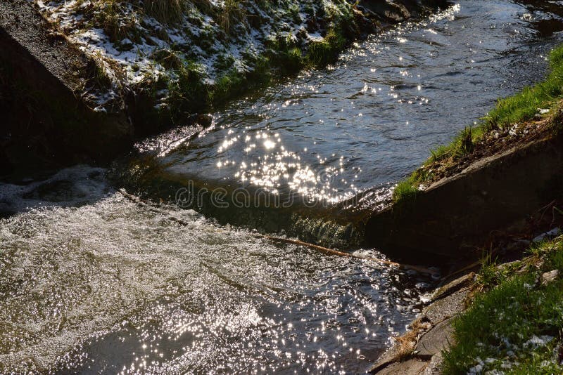 A Small Stream Divided by a Concrete Dam, a Sunny Spring Day Stock ...