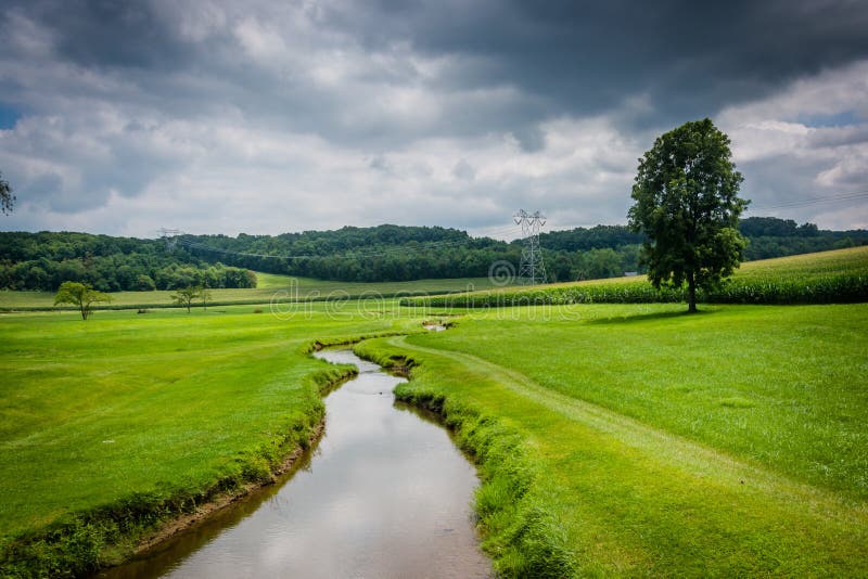 Stream through field stock image. Image of grassland - 78487731