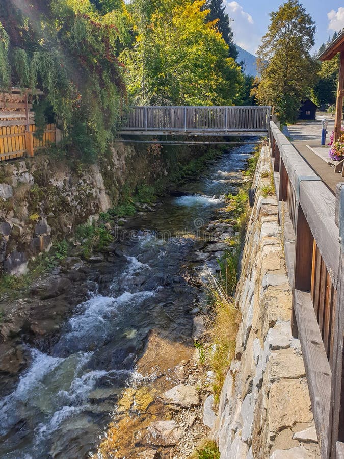 Small Stream in a Village with a Bridge Stock Image - Image of bridge ...
