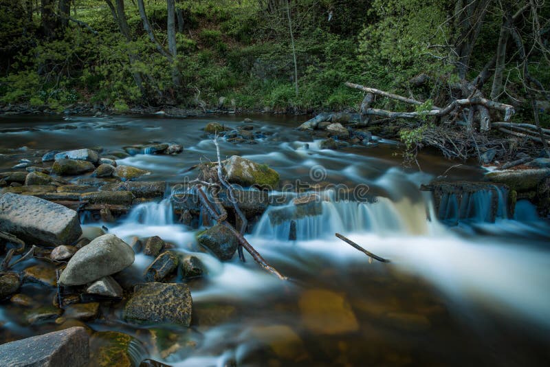 A Small Stream with Waterfalls in the Woods Stock Photo - Image of ...