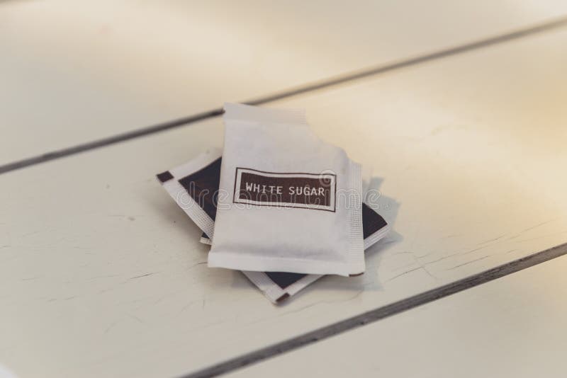 Small Sugar Packet on the Wooden Table Stock Photo - Image of supply ...