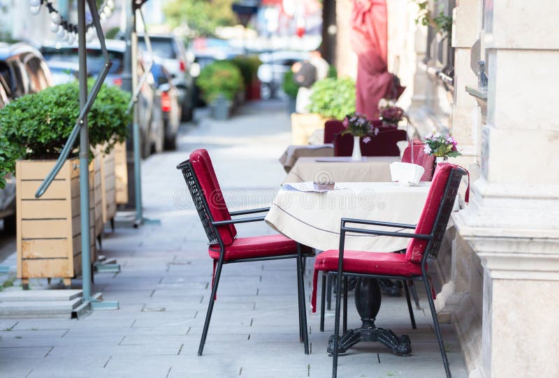 Small Table with Chairs of a Street Cafe Editorial Photography - Image ...