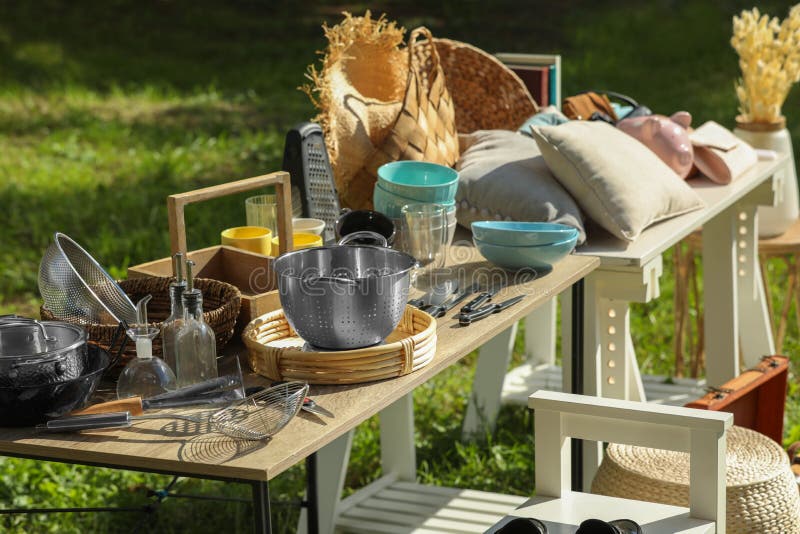 Small Tables with Many Different Items on Garage Sale Outdoors Stock ...