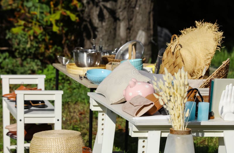 Small Tables with Many Different Items on Garage Sale Outdoors Stock ...