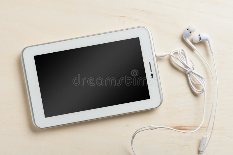 Small Tablet Pc with in Ear Headset Stock Photo - Image of music ...