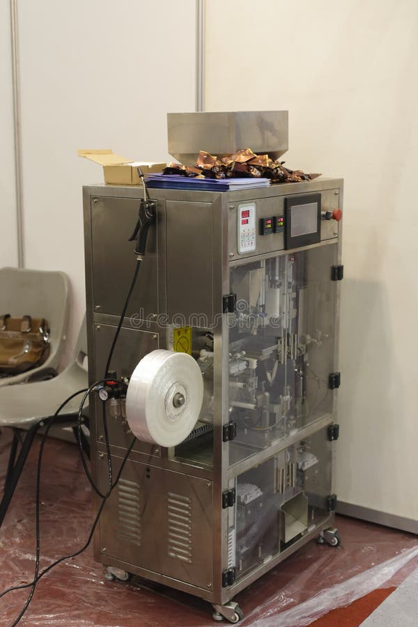Small tea packing machine editorial photography. Image of robotic ...