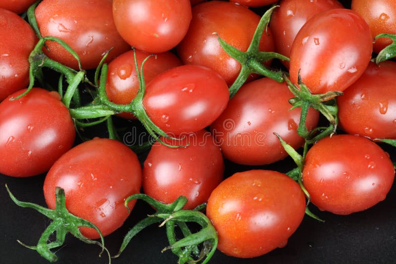 Small tomatoes in a basket stock photo. Image of vegetables - 26469732