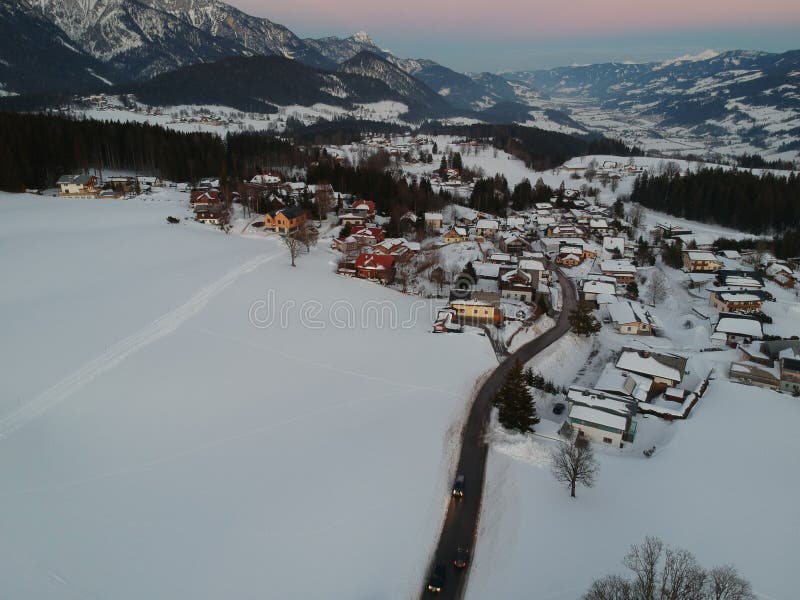A Small Town on a Snowy Mountain Side in a Valley Stock Photo - Image ...