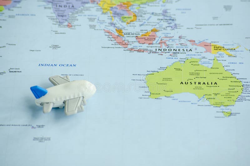 Small Toy Airplane Flying on World Map.Travel and Destination Concept ...