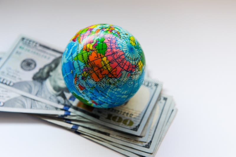 Small Toy Globe on a Stack of Money Stock Image - Image of economics ...