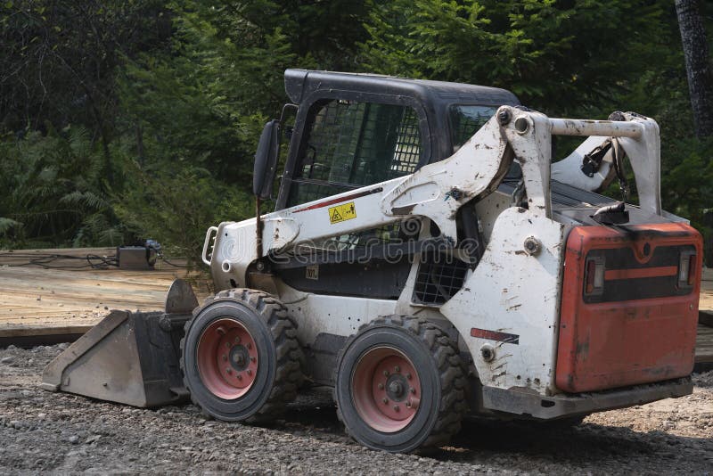 Small Tractor with Bucket. White Tractor on Four Wheels Stock Image ...
