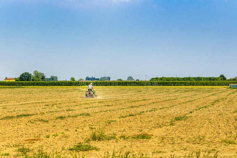 Small Tractor Plowing a Large Field Editorial Photo - Image of harvest ...