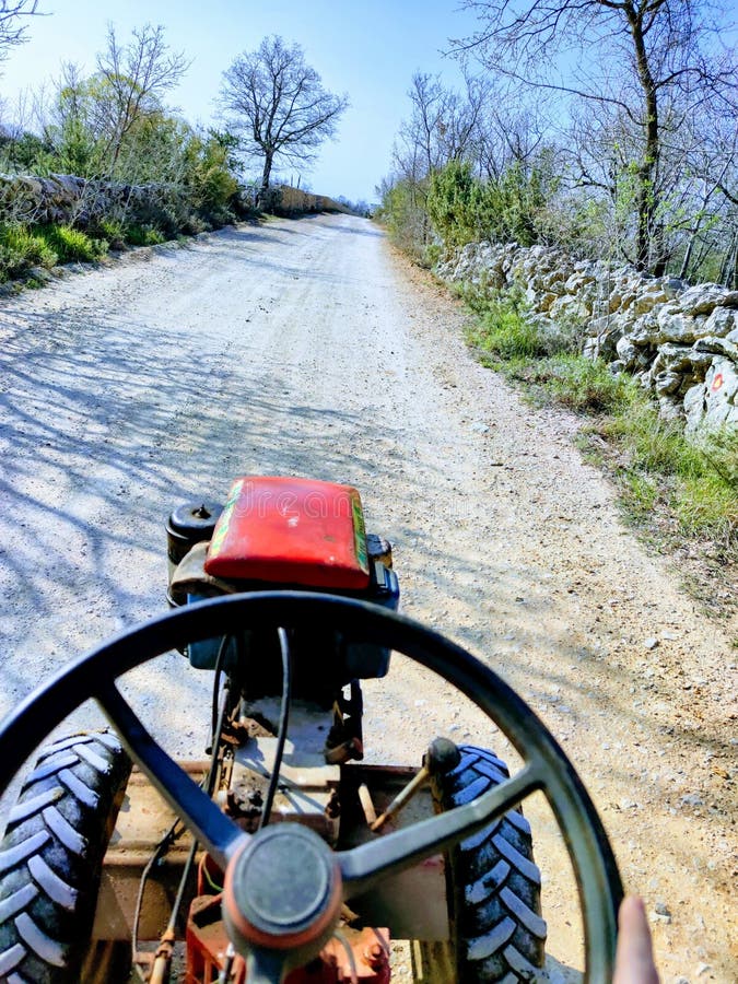 Small Tractor on White Road Stock Image - Image of nature, road: 177969893