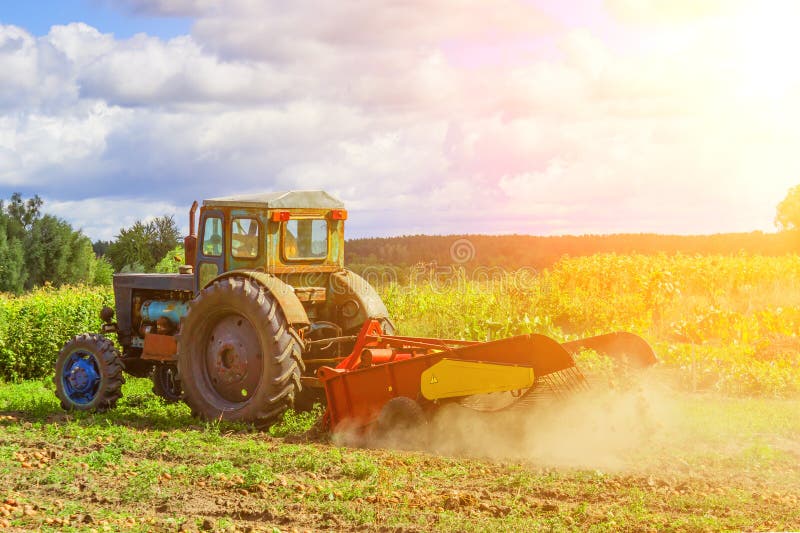 Small Tractor Working in the Field. Smallholder Agriculture Stock Photo ...