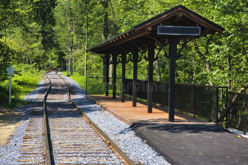 Small Train Station Waiting for Passengers and a Train Stock Image ...