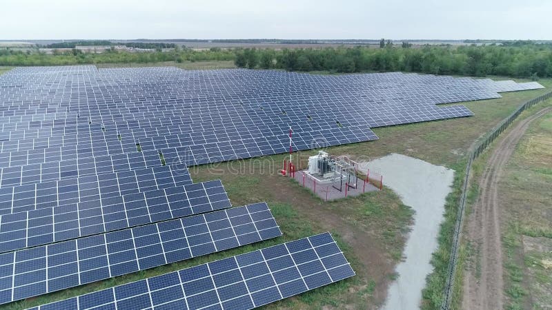 Small Transformer in the Field Next To the Rows of Solar Panels, Power ...